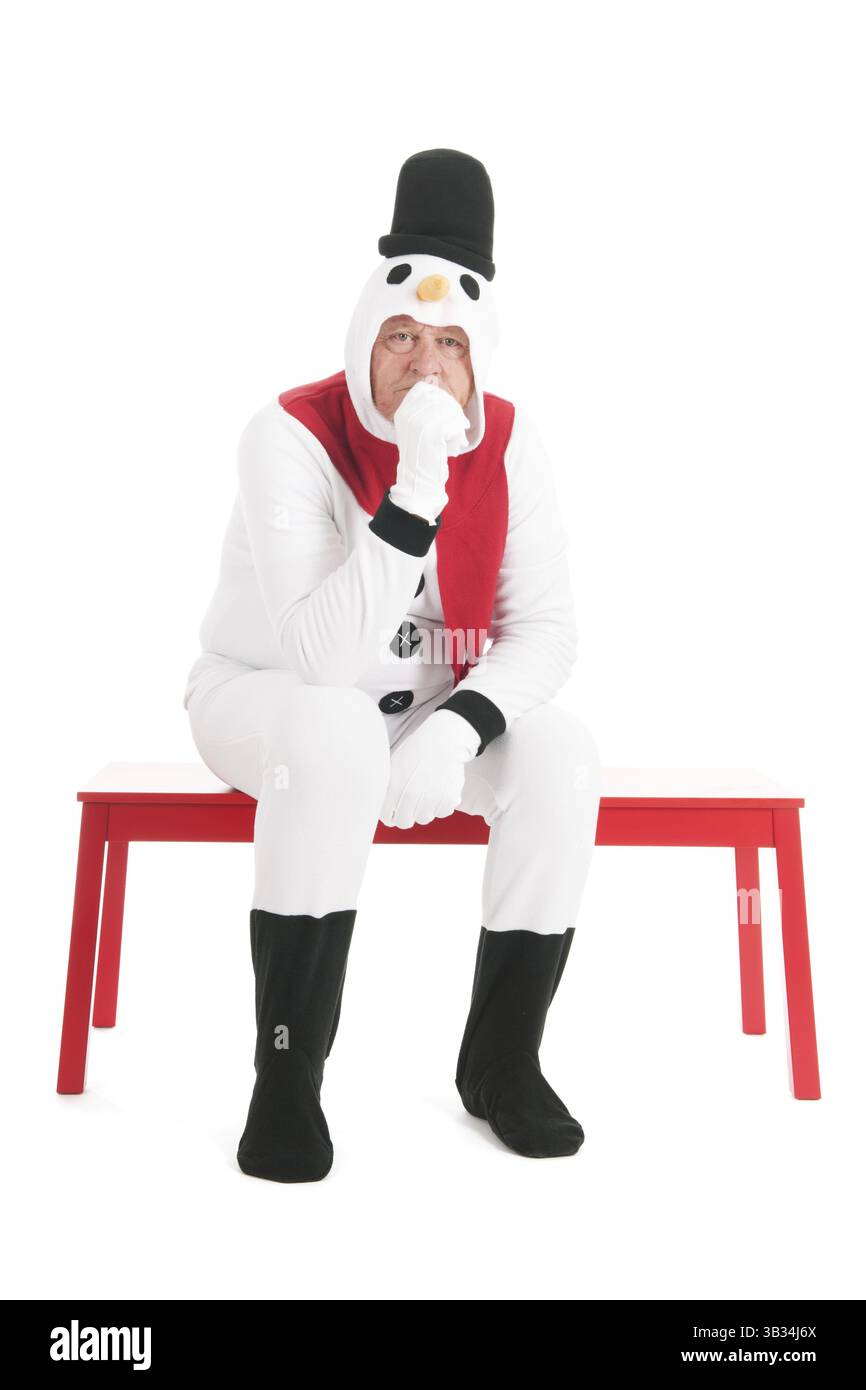 Human snowman sitting on beng isolated over white background Stock ...