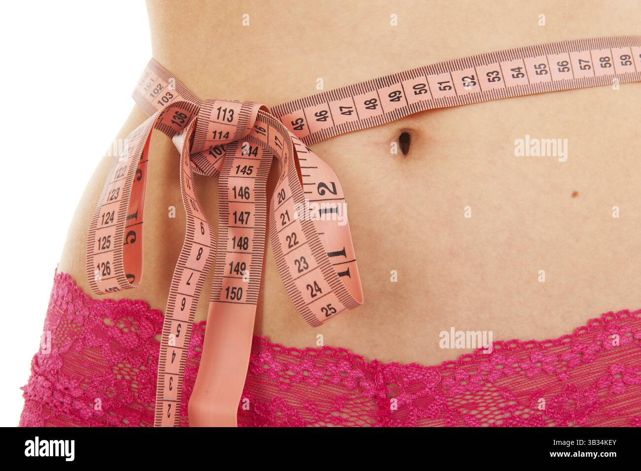 Measure the female waist with tape Stock Photo - Alamy