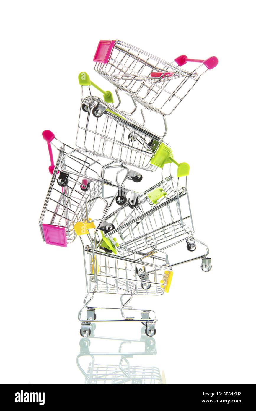 Stack of empty shopping carts isolated white background Stock Photo - Alamy