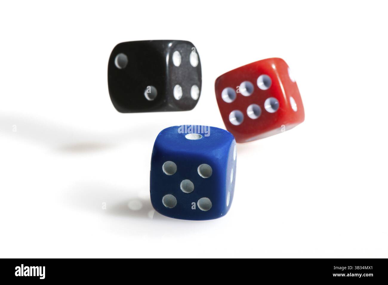 Rolling colorful dices isolated over white background Stock Photo - Alamy
