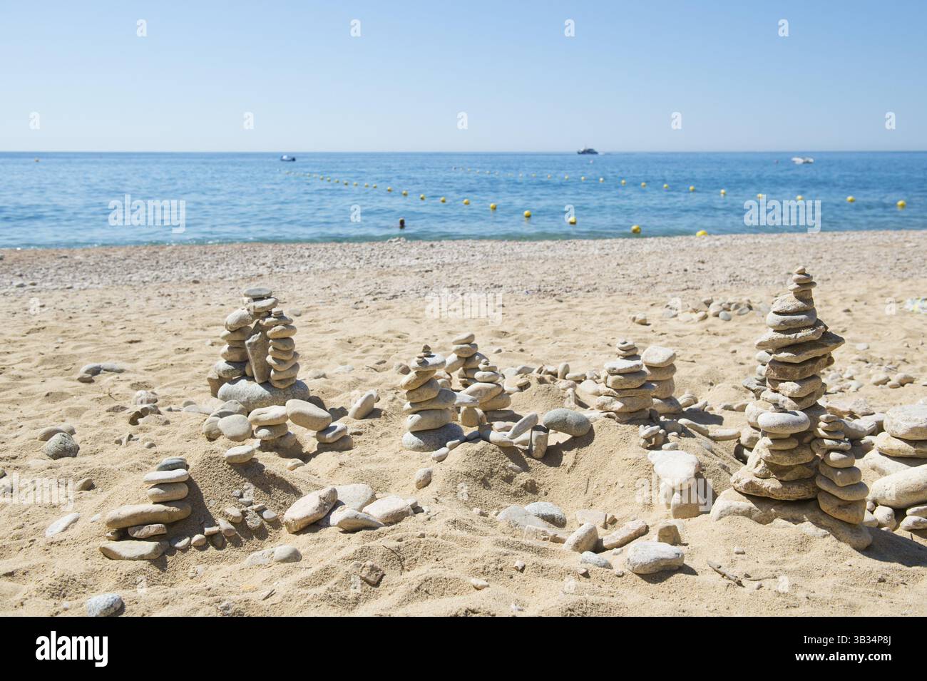 Stacked stones at the beach Stock Photo - Alamy