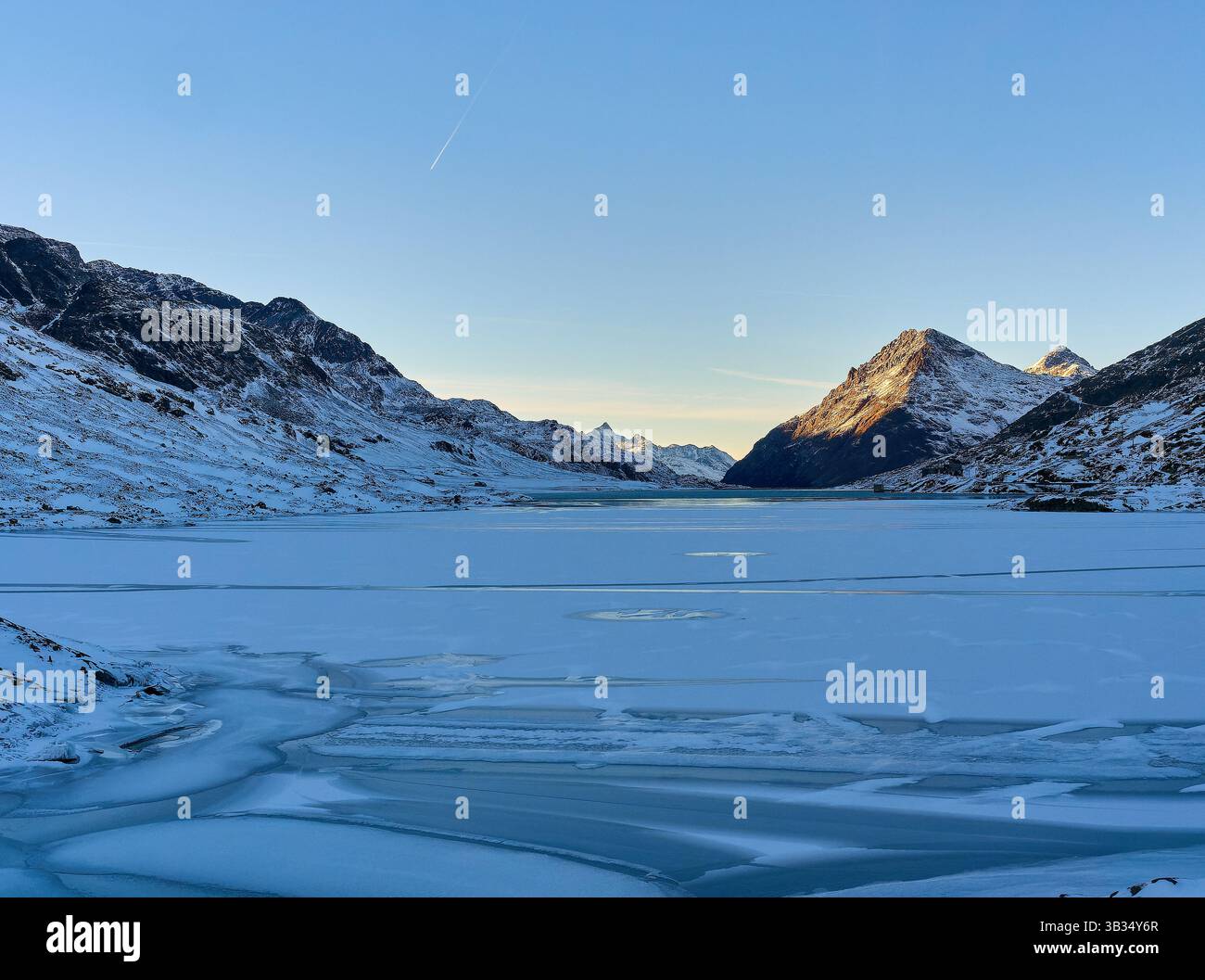 Frozen Alpine Lake and Snowy Peaks Seen from Bernina Express Stock ...