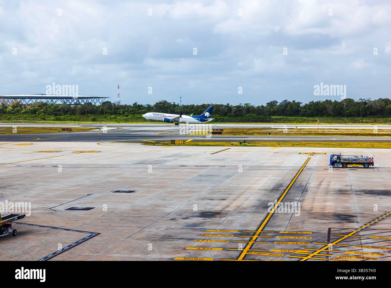 Aero Mexico airplane taking off from runway at Cancun International ...