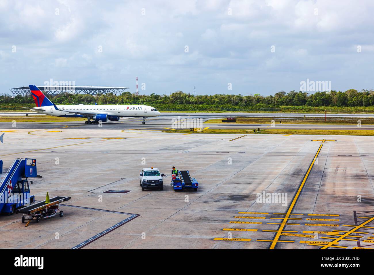 Delta Air Lines airplane taxiing on runway at Cancun International ...