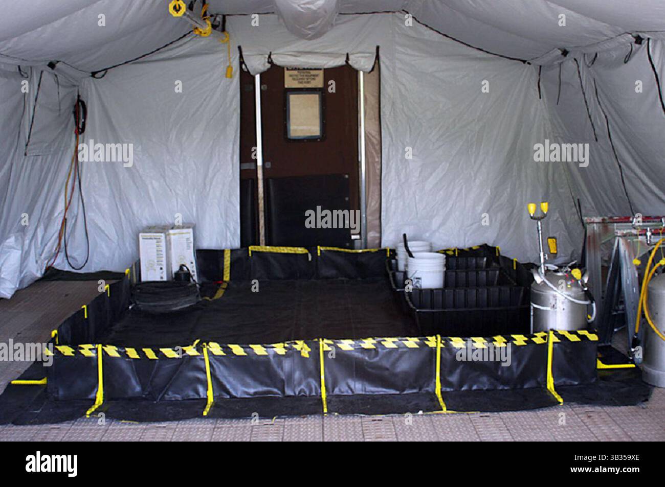 Sept. 12, 2013 - Operators enter and exit the enclosure through the PDS ...