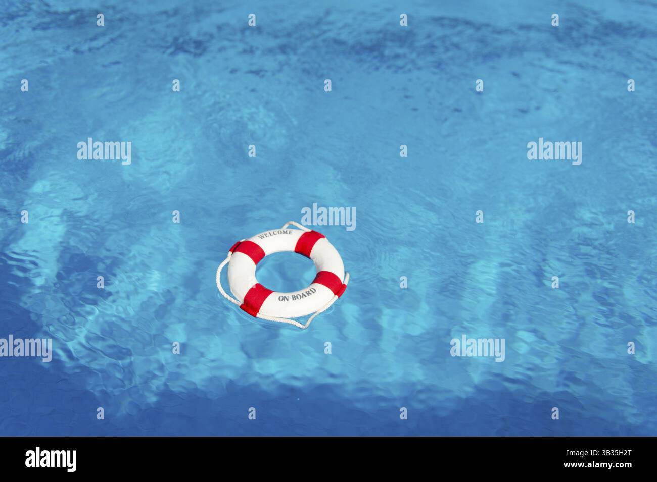 Life buoy floating on water with text welcome on board Stock Photo - Alamy