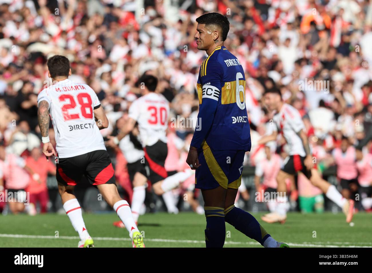 Boca Juniors' defender Marcos Rojo (C) reacts while River Plate's ...