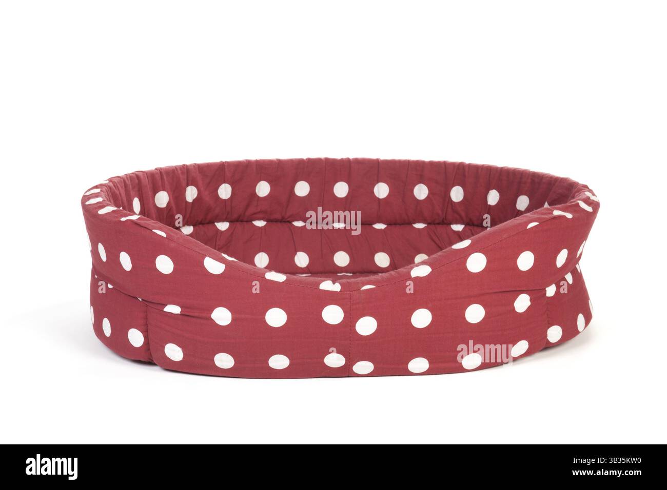 Red spotted empty pet bed Stock Photo - Alamy