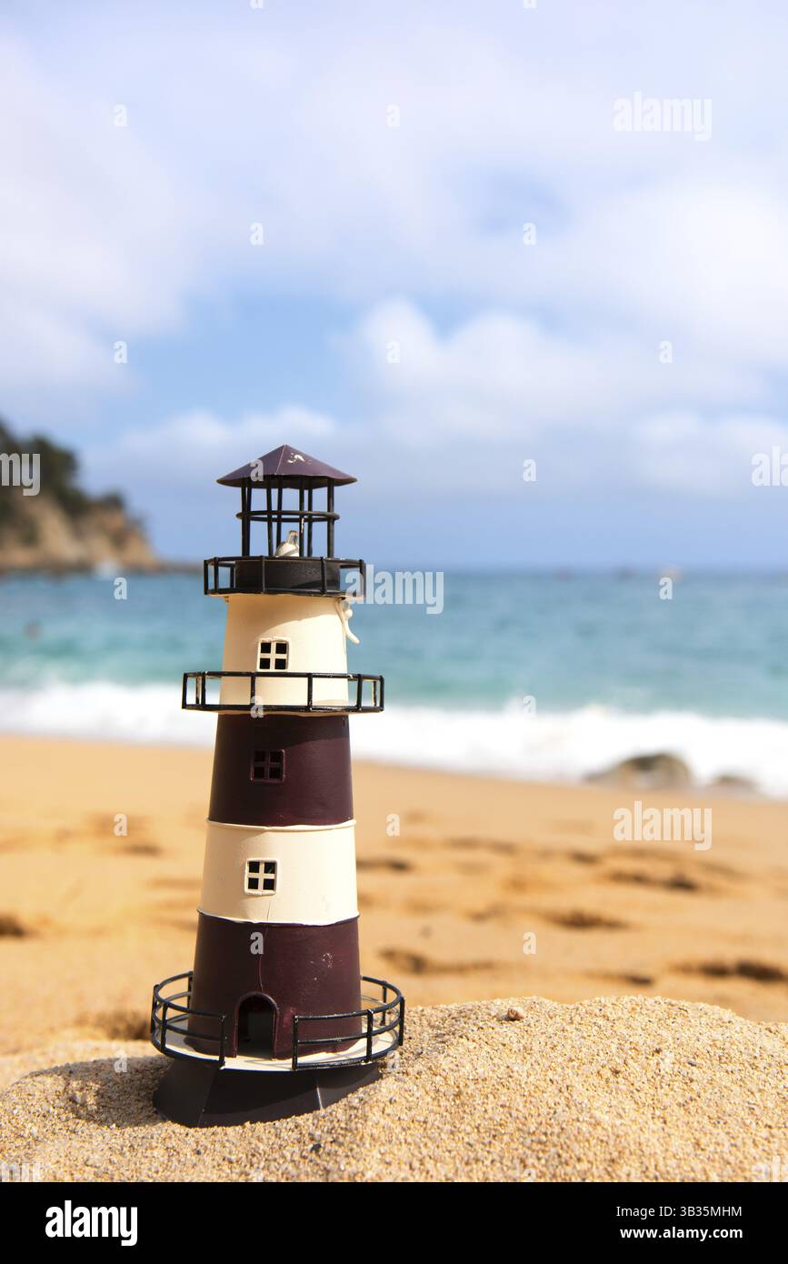Miniature lighthouse at the beach Stock Photo - Alamy