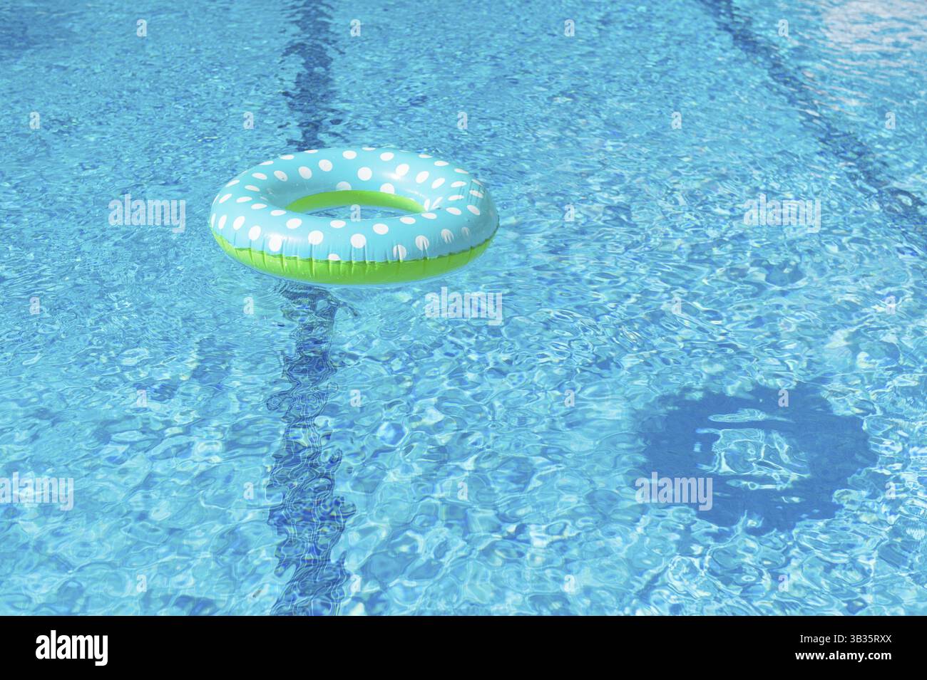 Floating inflatable toy in swimming pool Stock Photo - Alamy