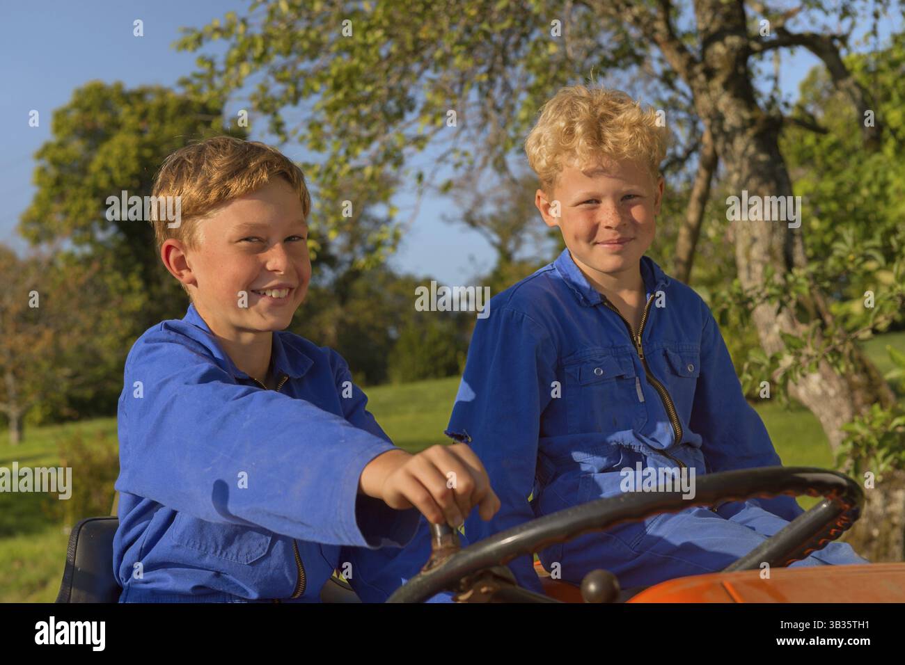 Boys and tractors hi-res stock photography and images - Alamy