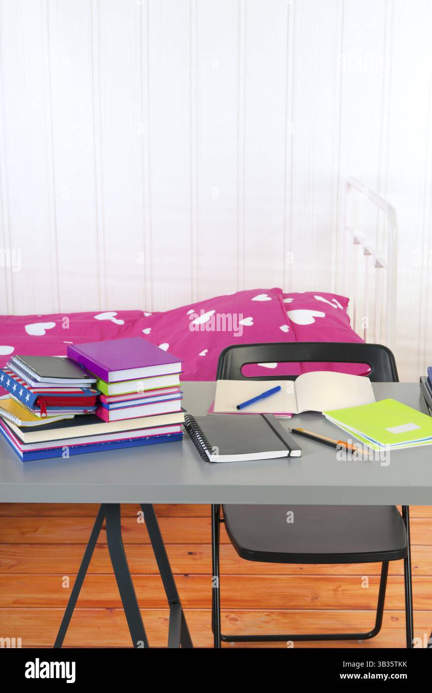 Making homework in bedroom Stock Photo - Alamy