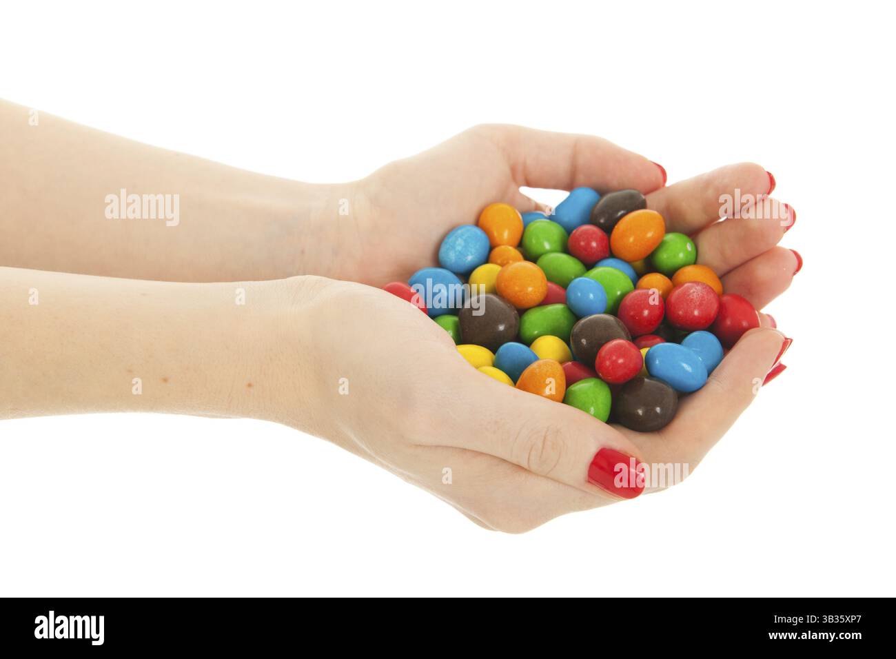 Woman with colorful candy in hands Stock Photo - Alamy