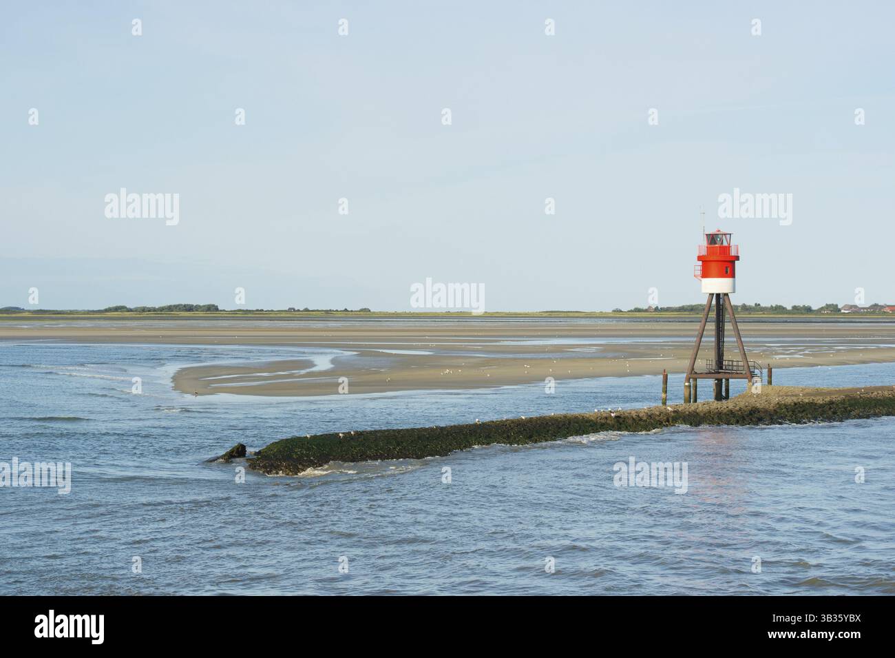 Red beacon near the harbor of Borkum island Stock Photo - Alamy