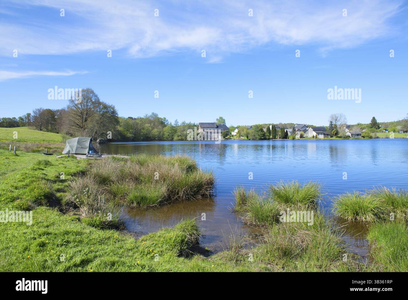 Lake in French Limousin with fishing tent and place Stock Photo - Alamy