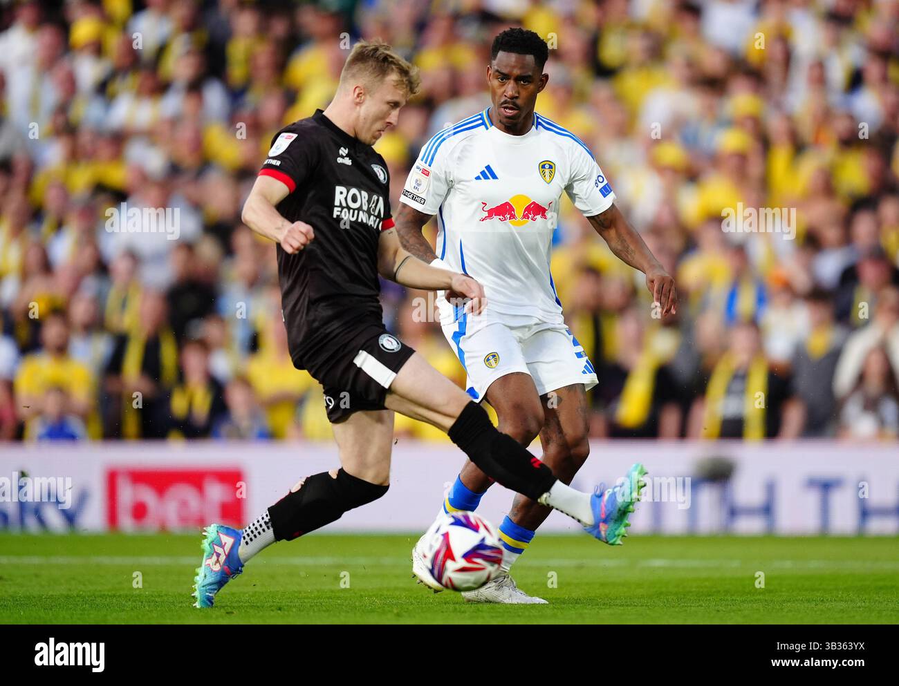 Bristol City's Ross McCrorie (left) and Leeds United's Junior Firpo ...