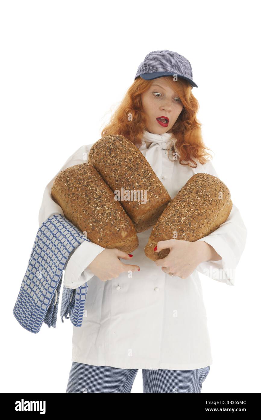 Female baker chef with red hair and baked bread isolated over white ...