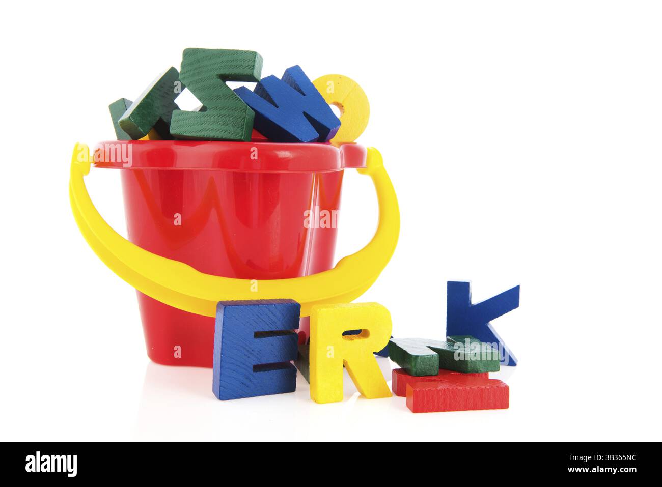 Many vintage wooden letters in toy bucket isolated over white ...