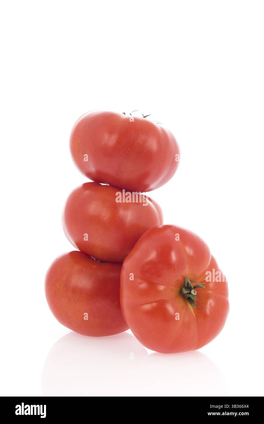 Big red fresh French tomatoes type Coeur de boeuf isolated over white ...