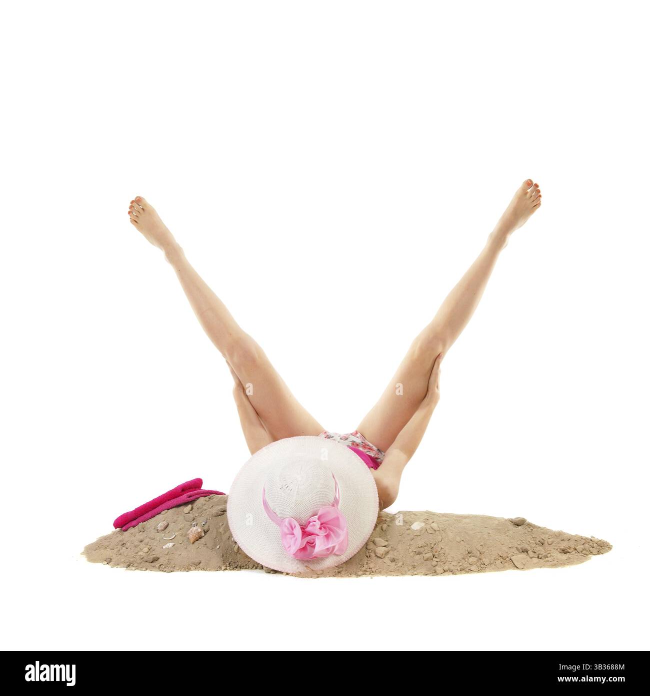 Woman laying at the beach with pink hat in studio isolated over white ...