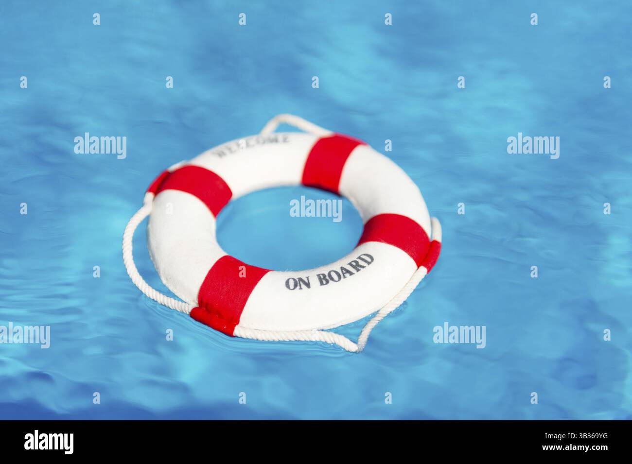 Life buoy floating on water with text welcome on board Stock Photo - Alamy