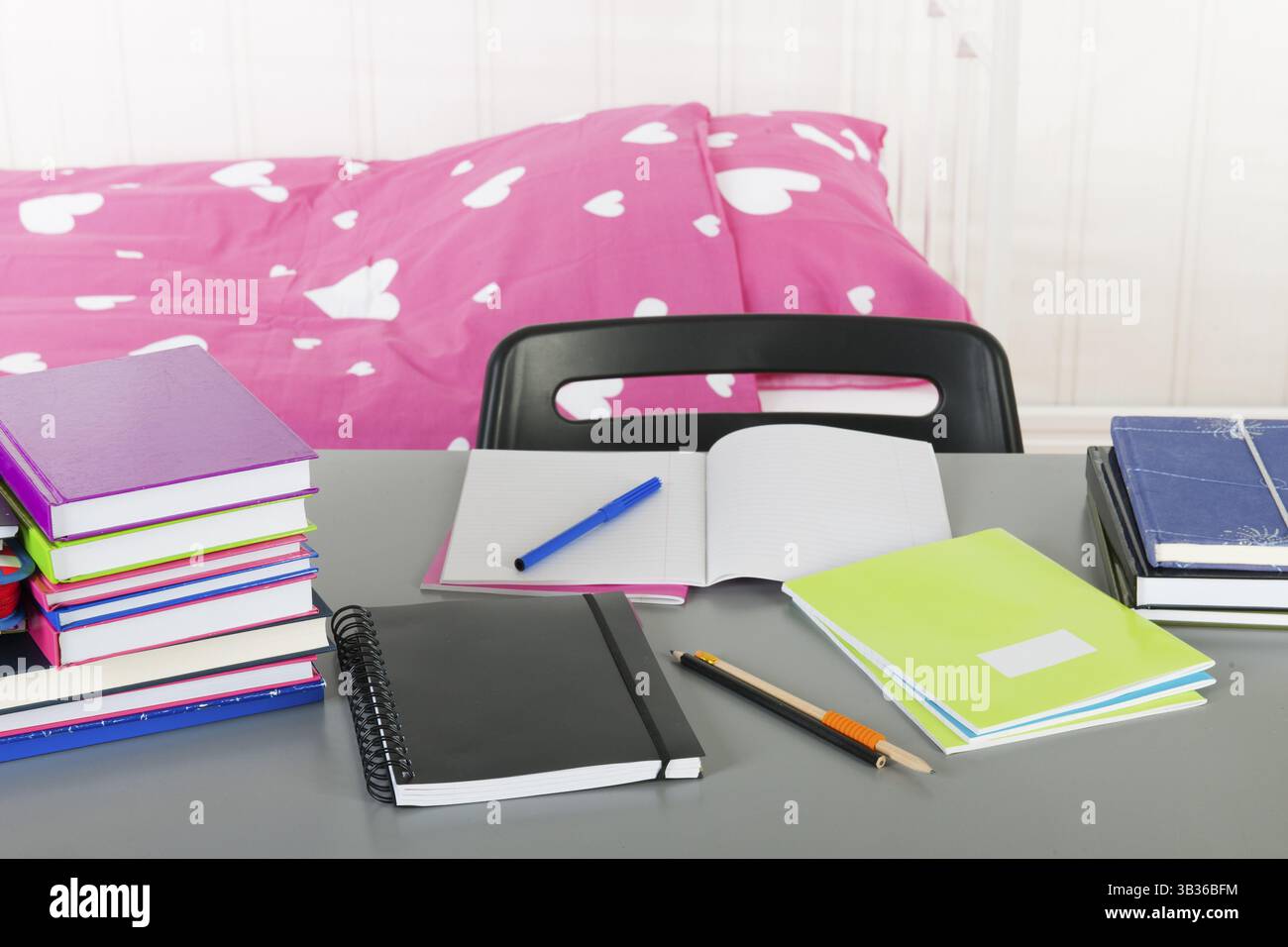 Making homework in bedroom Stock Photo - Alamy