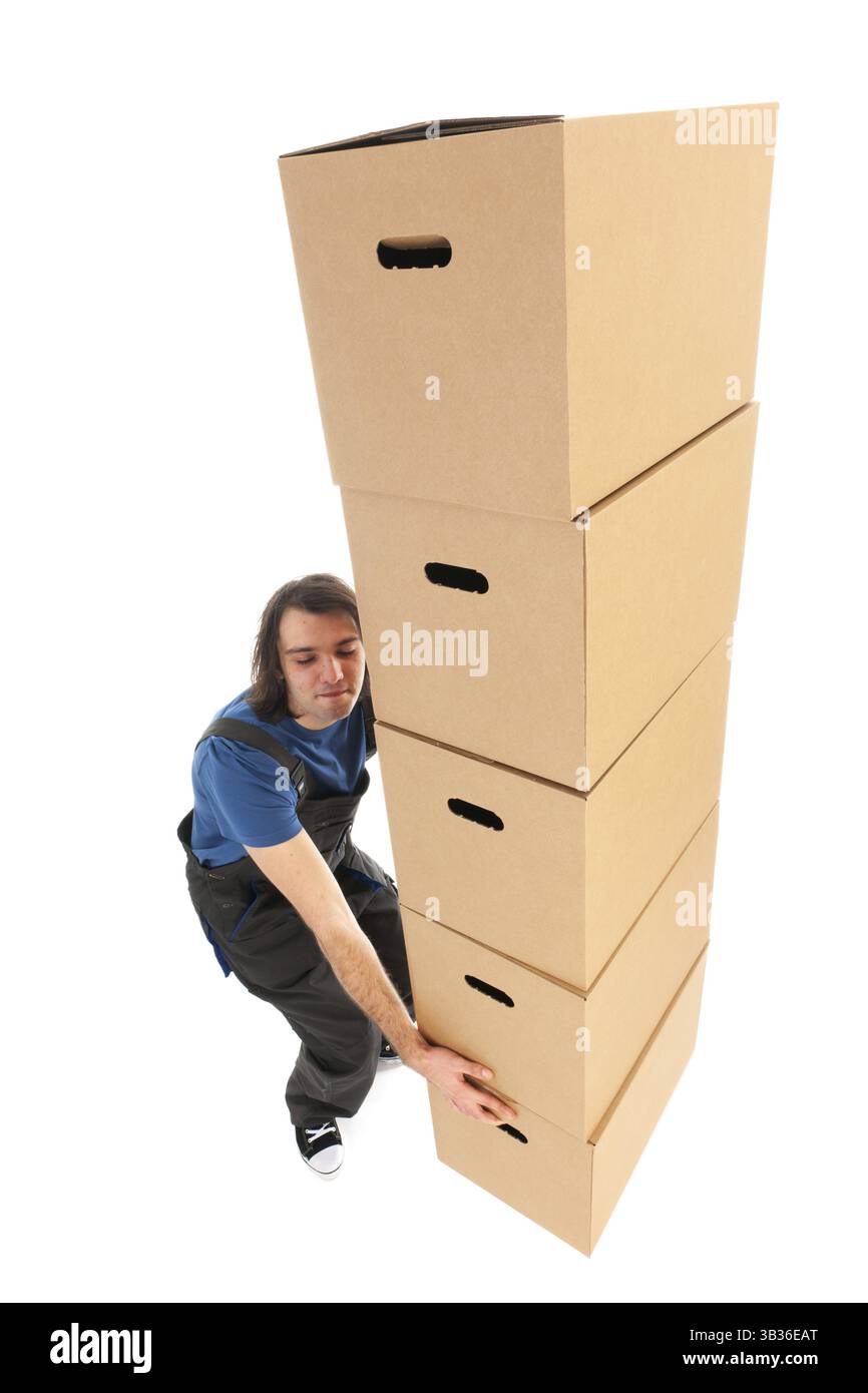 Mover with big stack of heavy boxes Stock Photo - Alamy