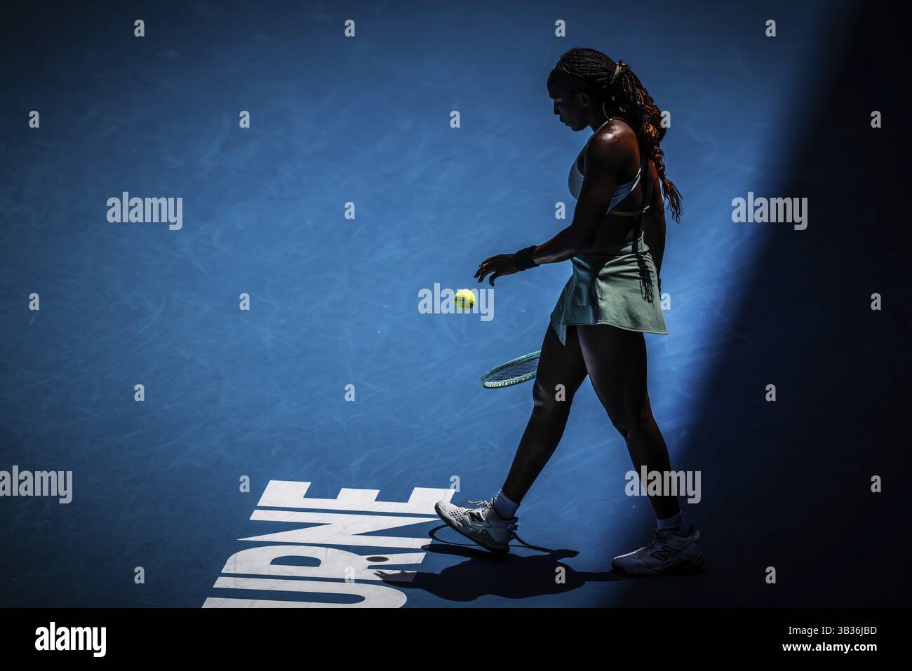 MELBOURNE, AUSTRALIA - JANUARY 19: Coco Gauff of USA serves to Belinda Bencic of Switzerland on ...