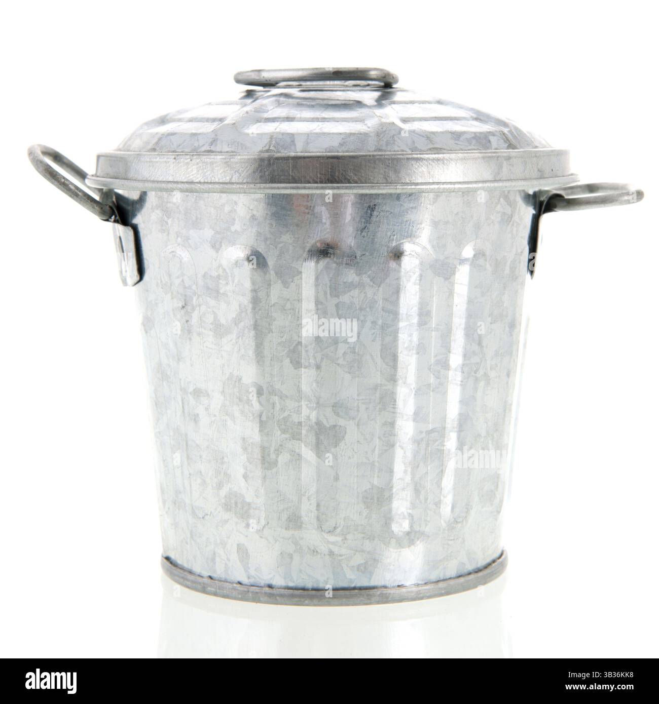 Metal trash can isolated over white background Stock Photo - Alamy