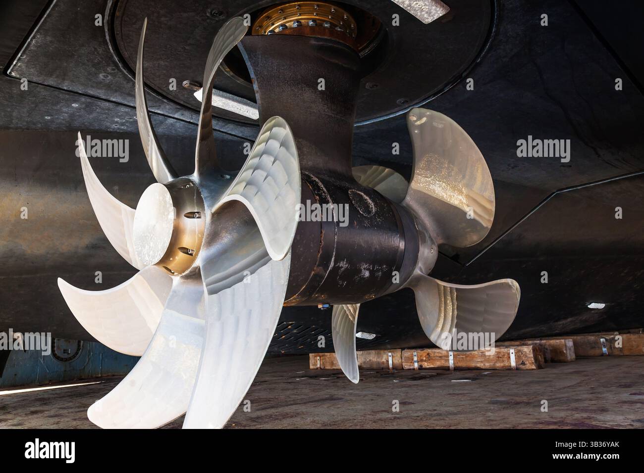 The bottom of a ship supported in dry dock with azimuth propulsion and twin propellers aft Stock ...