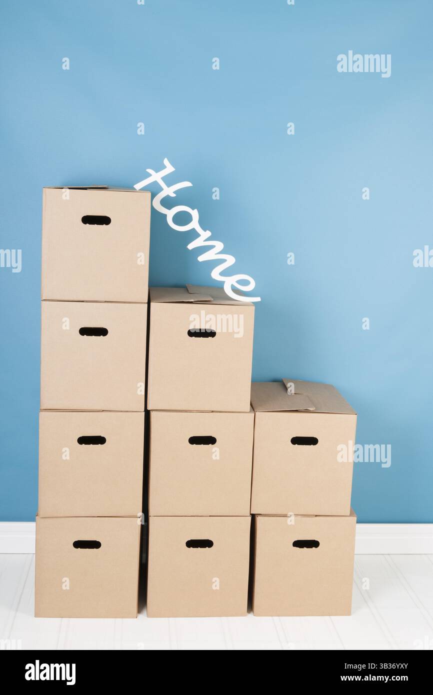 Removal house with boxes in interior Stock Photo - Alamy