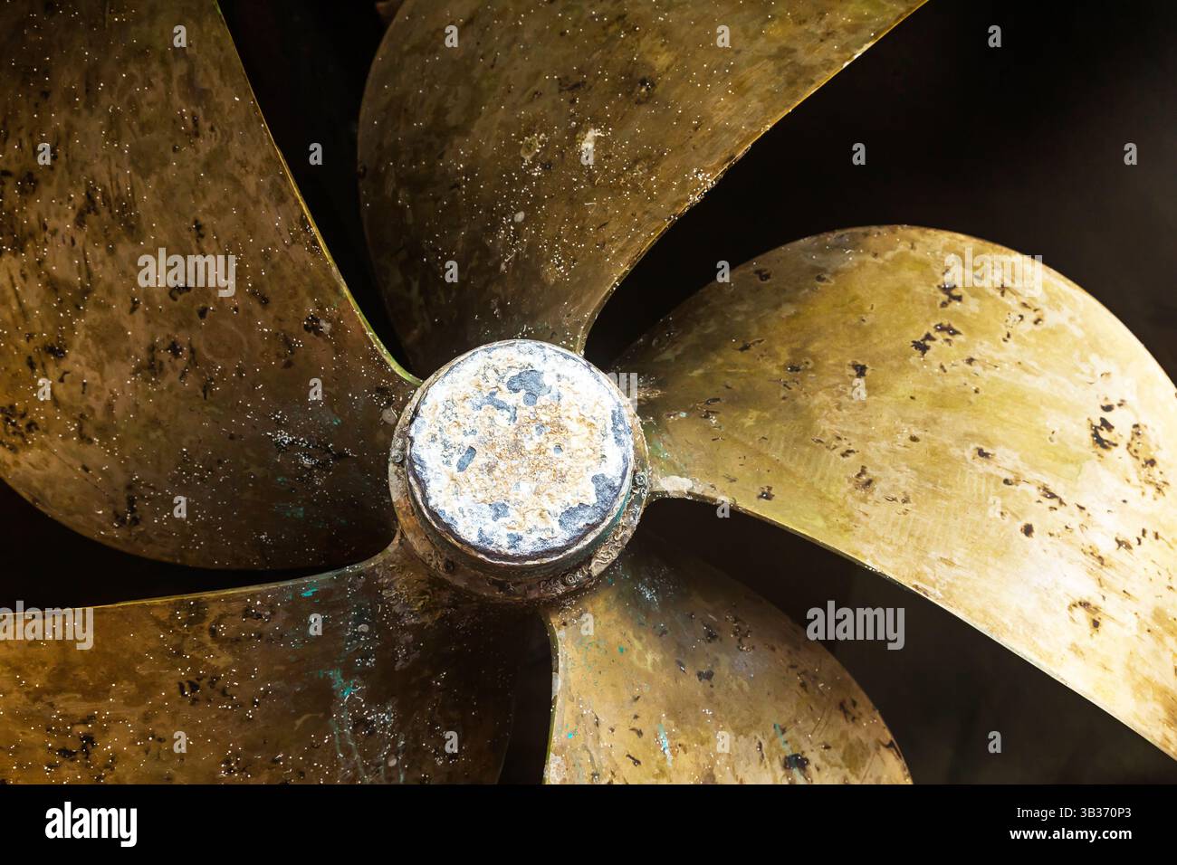Five bladed ship propeller close-up, with zinc corrosion protection in ...