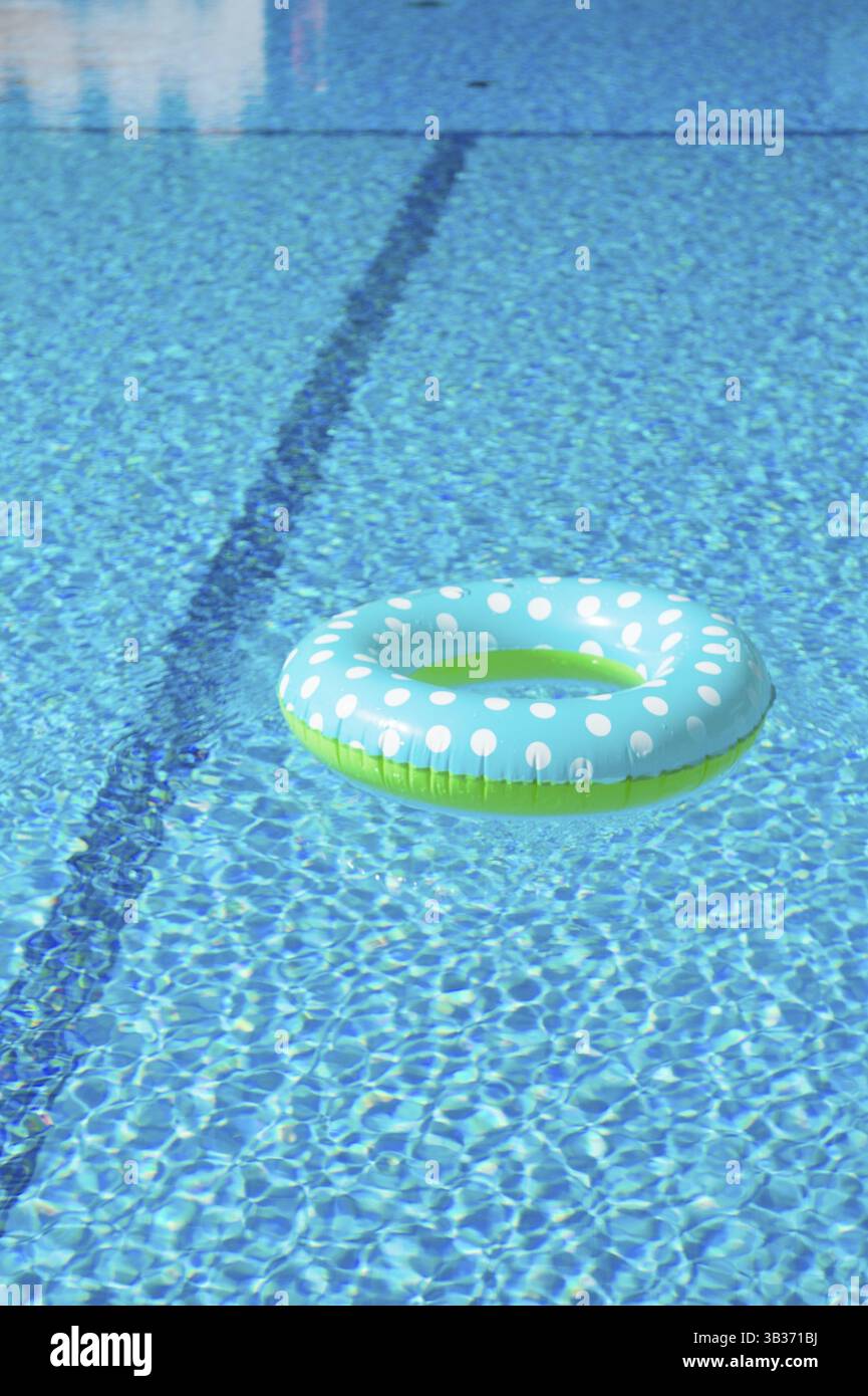 Floating inflatable toy in swimming pool Stock Photo - Alamy