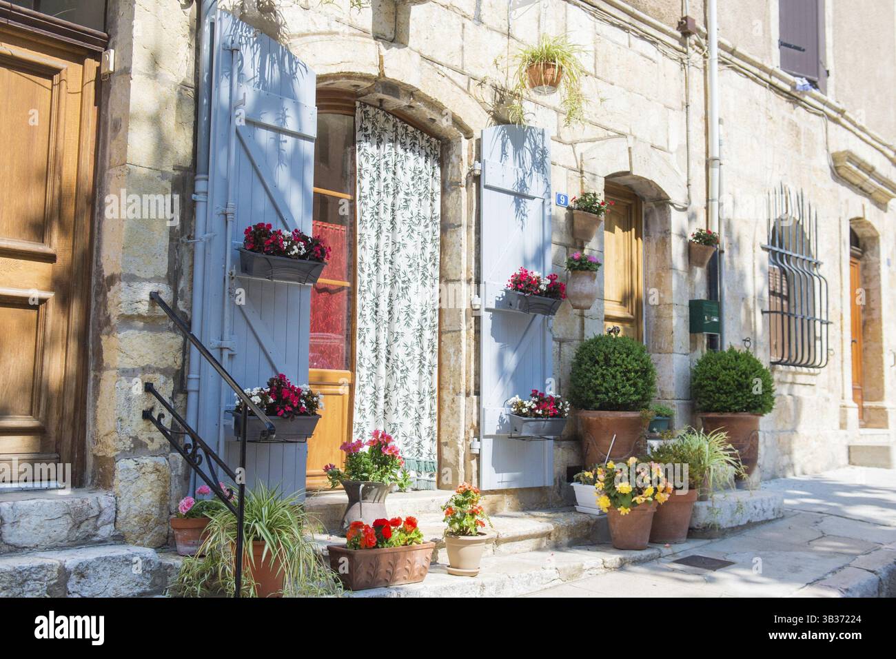 Typical French house with flowers and plants outdoor Stock Photo - Alamy