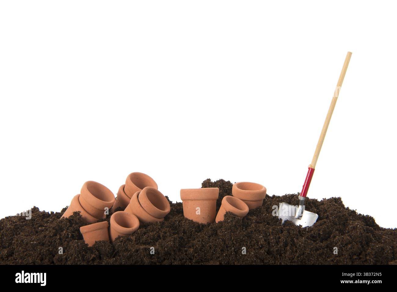Gardening with black earth flower pots and shovel Stock Photo - Alamy