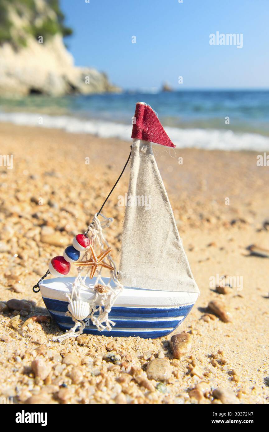 Miniature fishing boat at beach Stock Photo - Alamy