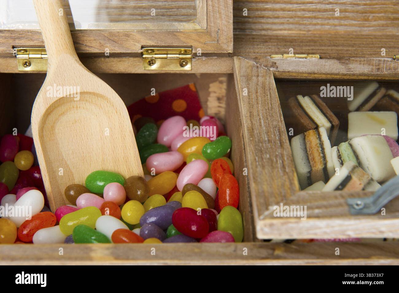 Wooden candy bar with assortment sweets isolated over white Stock Photo ...