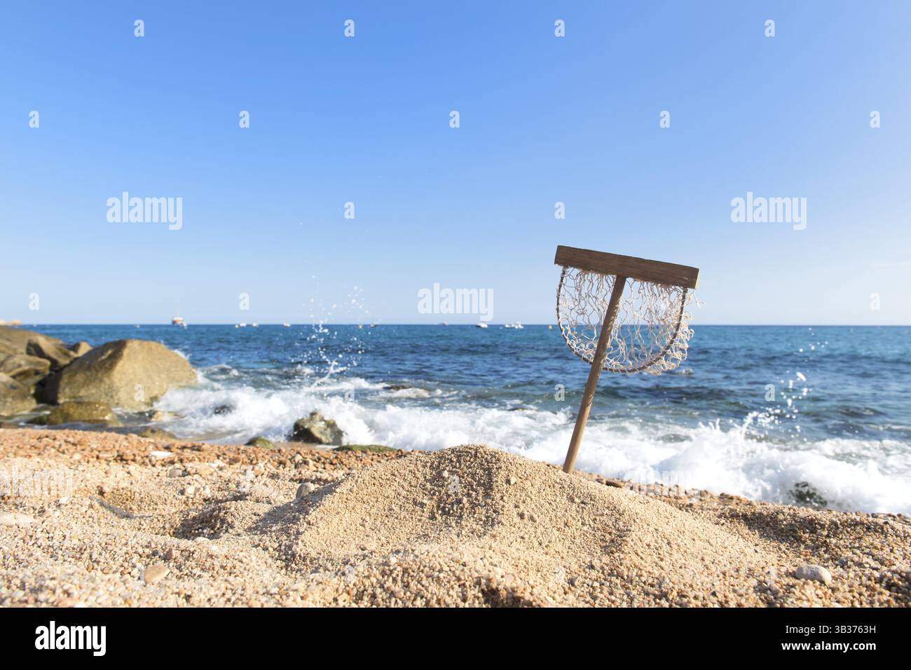 Fishing net in sand at the beach Stock Photo - Alamy