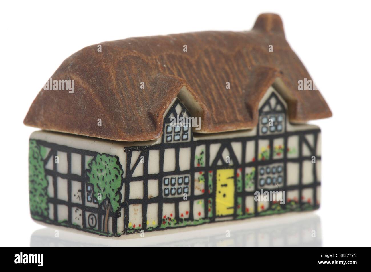 Very old English cottage with timbered wood isolated over white ...