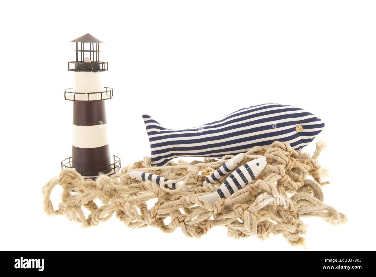 Fishing net with lighthouse and artificial fish Stock Photo - Alamy