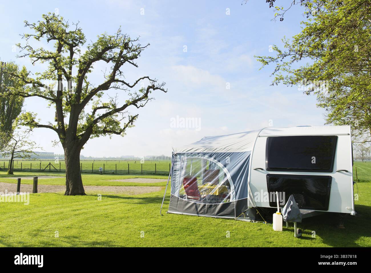 Campground with caravan in spring Stock Photo - Alamy