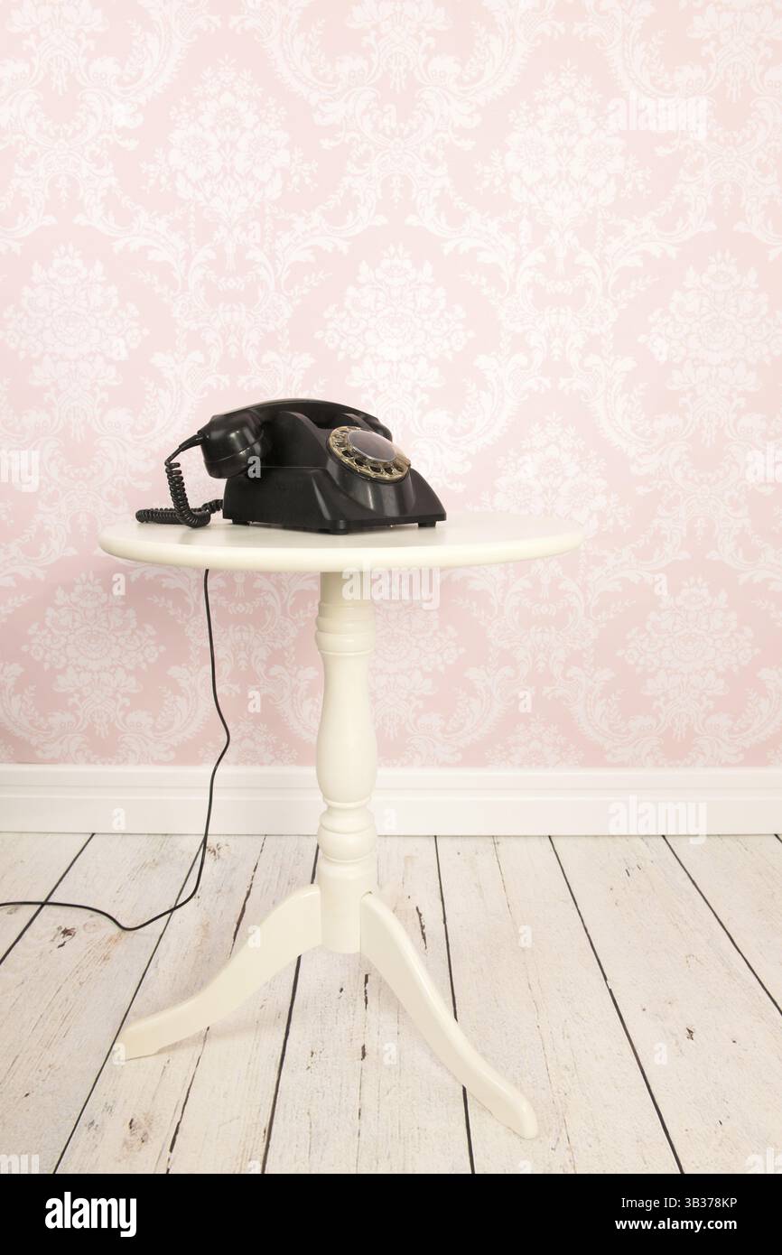 Old black telephone in vintage room Stock Photo - Alamy