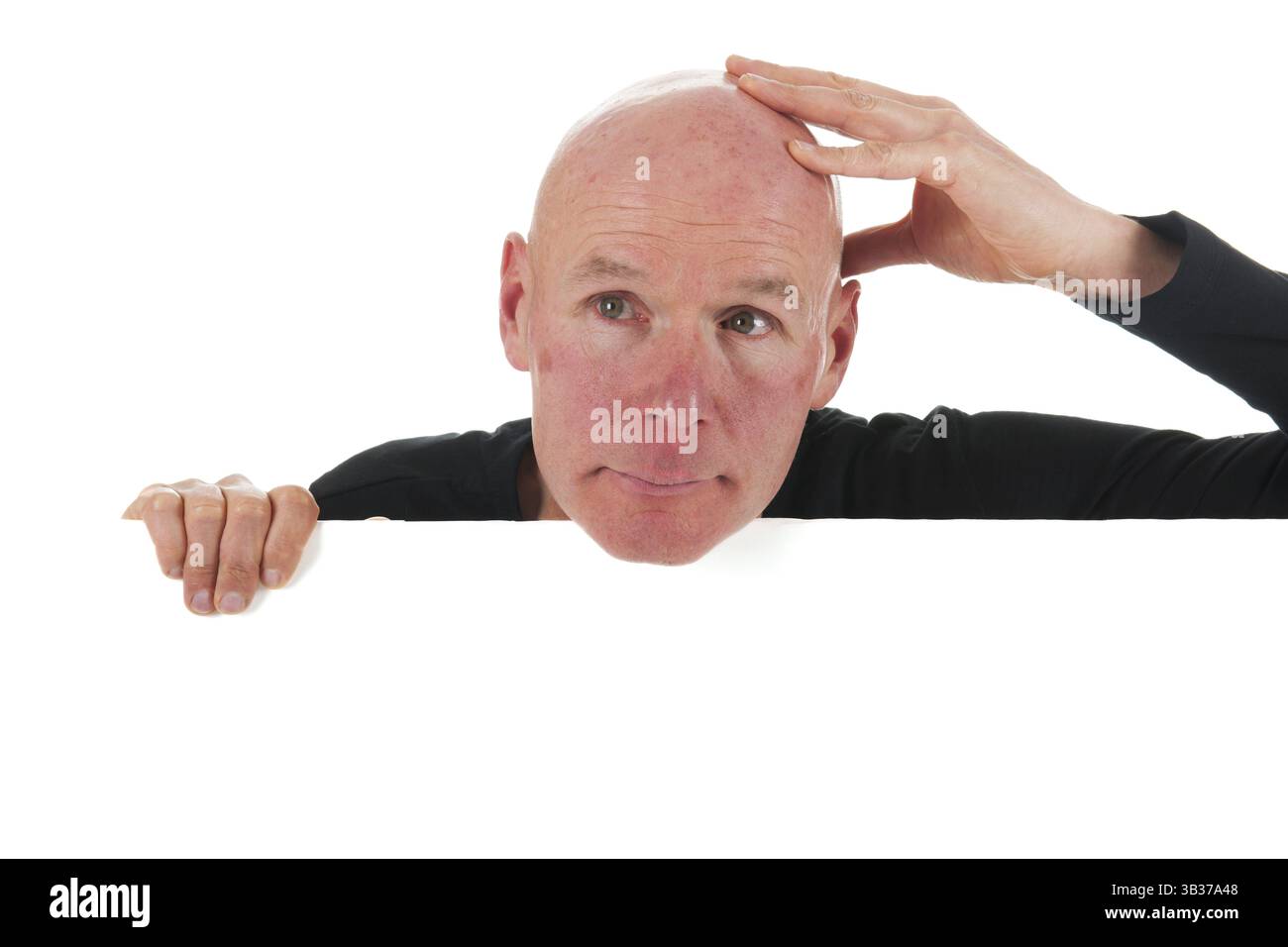 Portrait bald man with white board isolated in studio Stock Photo - Alamy