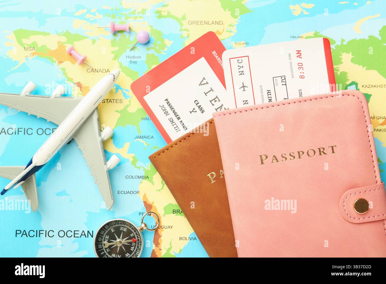 Passports with tickets, compass and plane model on world map, flat lay ...