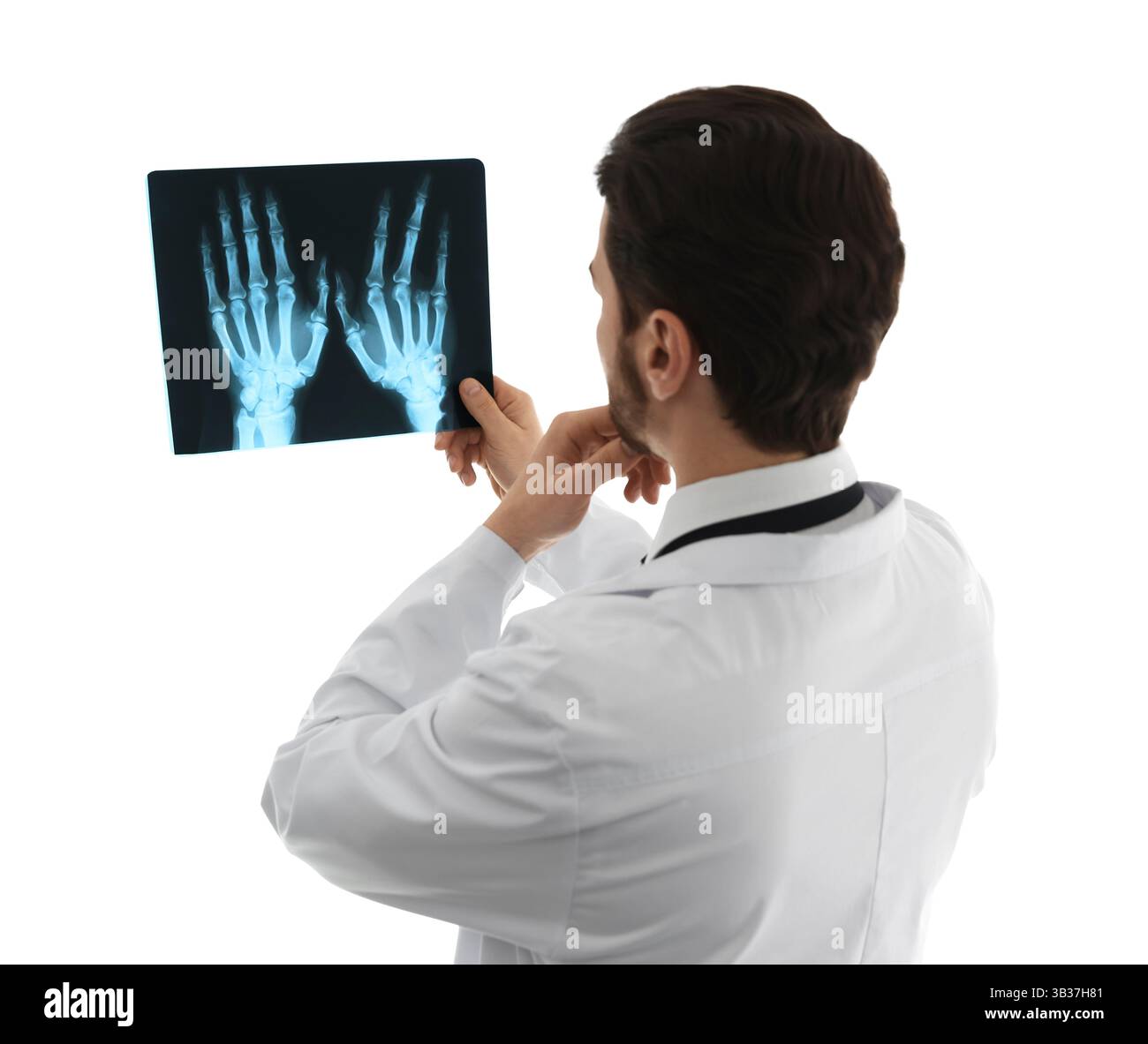 Doctor examining hand MRI scan on white background, back view Stock ...