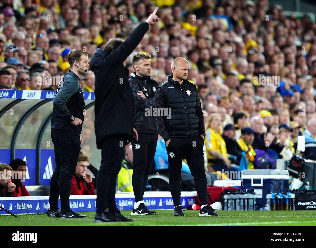 Bristol City manager Liam Manning (right) reacts on the touchline ...