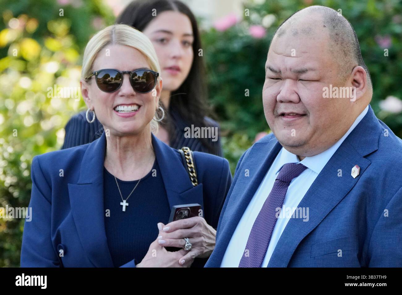 United States Attorney General Pam Bondi stands with White House ...