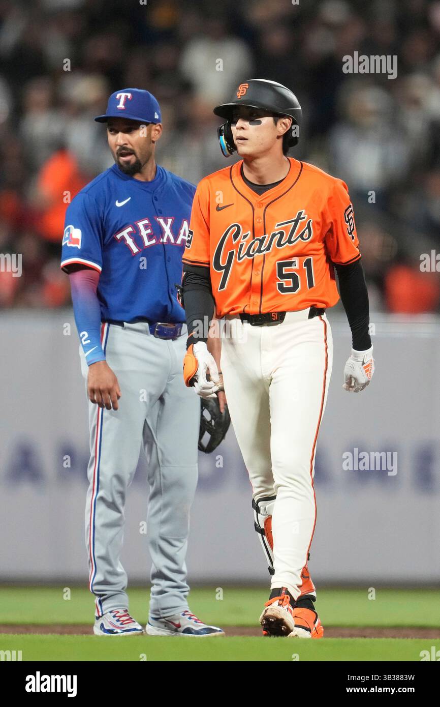 Texas Rangers second baseman Marcus Semien, left, and San Francisco ...