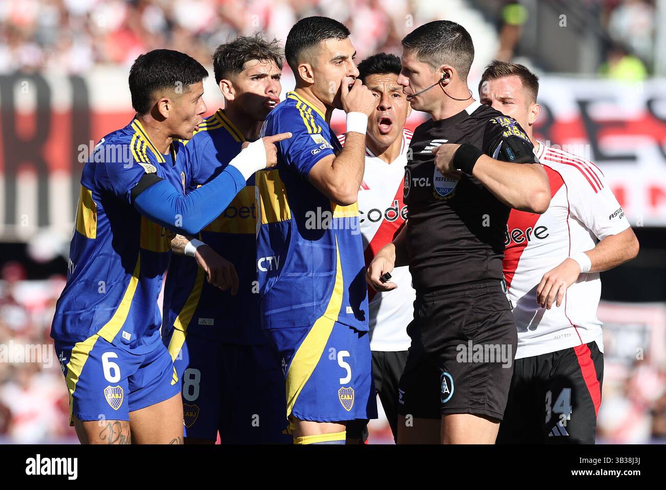 Boca Juniors' defender Marcos Rojo (L)argues Argentine referee Nicolas ...