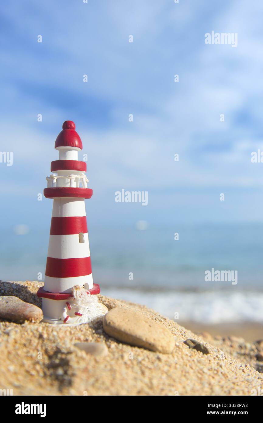 Miniature lighthouse at the beach Stock Photo - Alamy